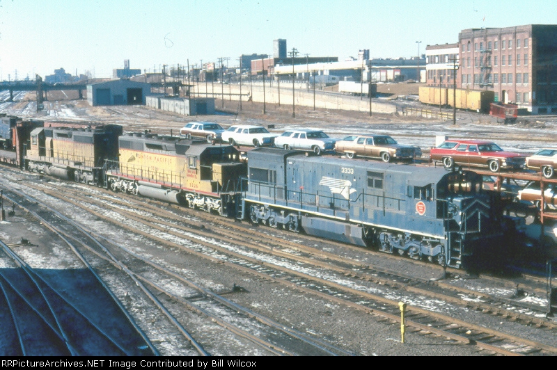 MP U30C 3333, UP SD40-2 3236 & UP SD40 3013 pass a load of new 1976 Buicks as seen from the 23rd ...